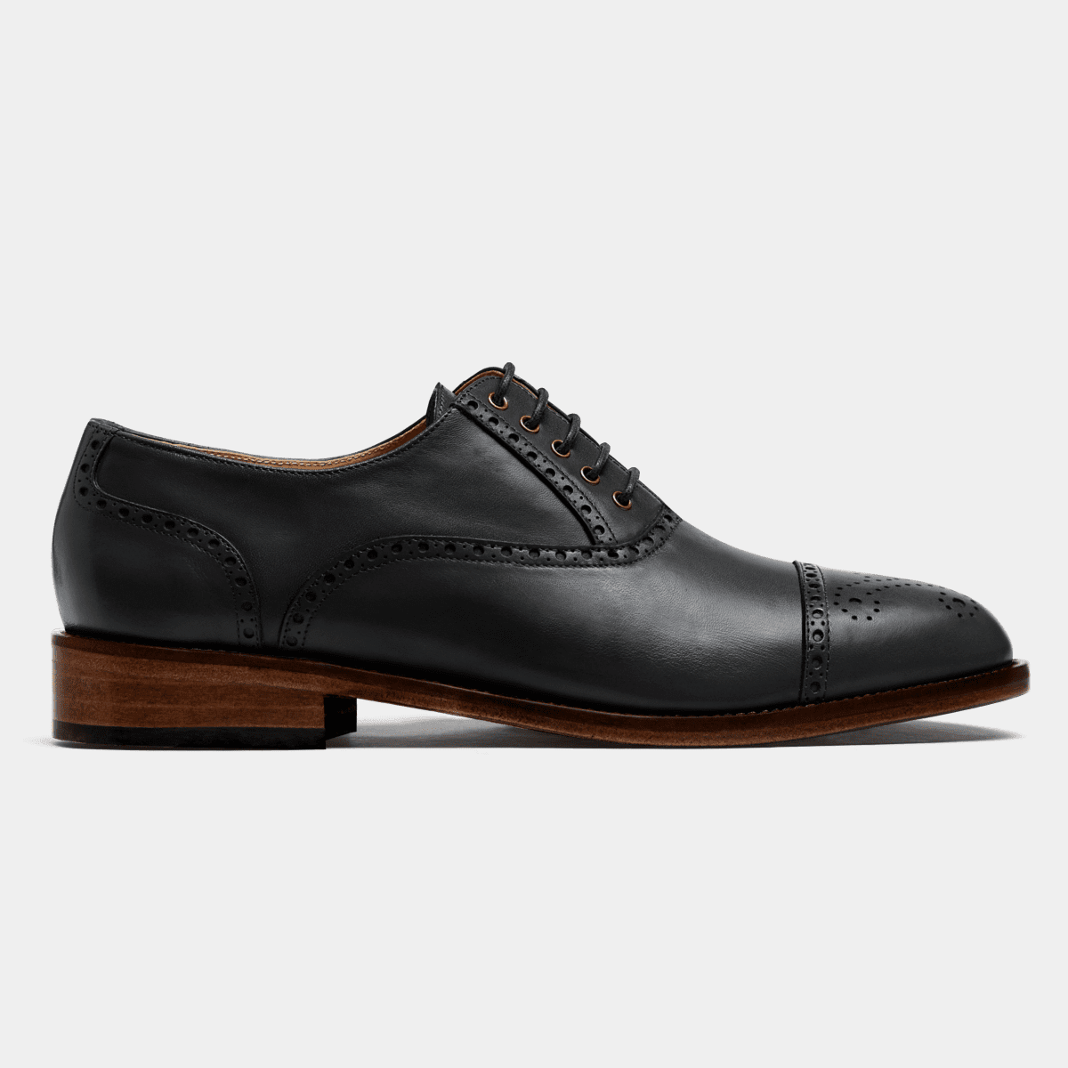 Semi-brogue shoes in black leather